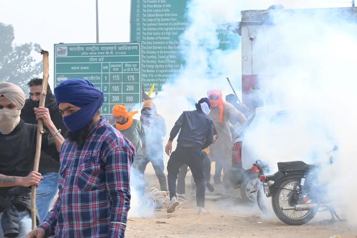 Police use tear gas against Indian farmers marching to New Delhi to ...