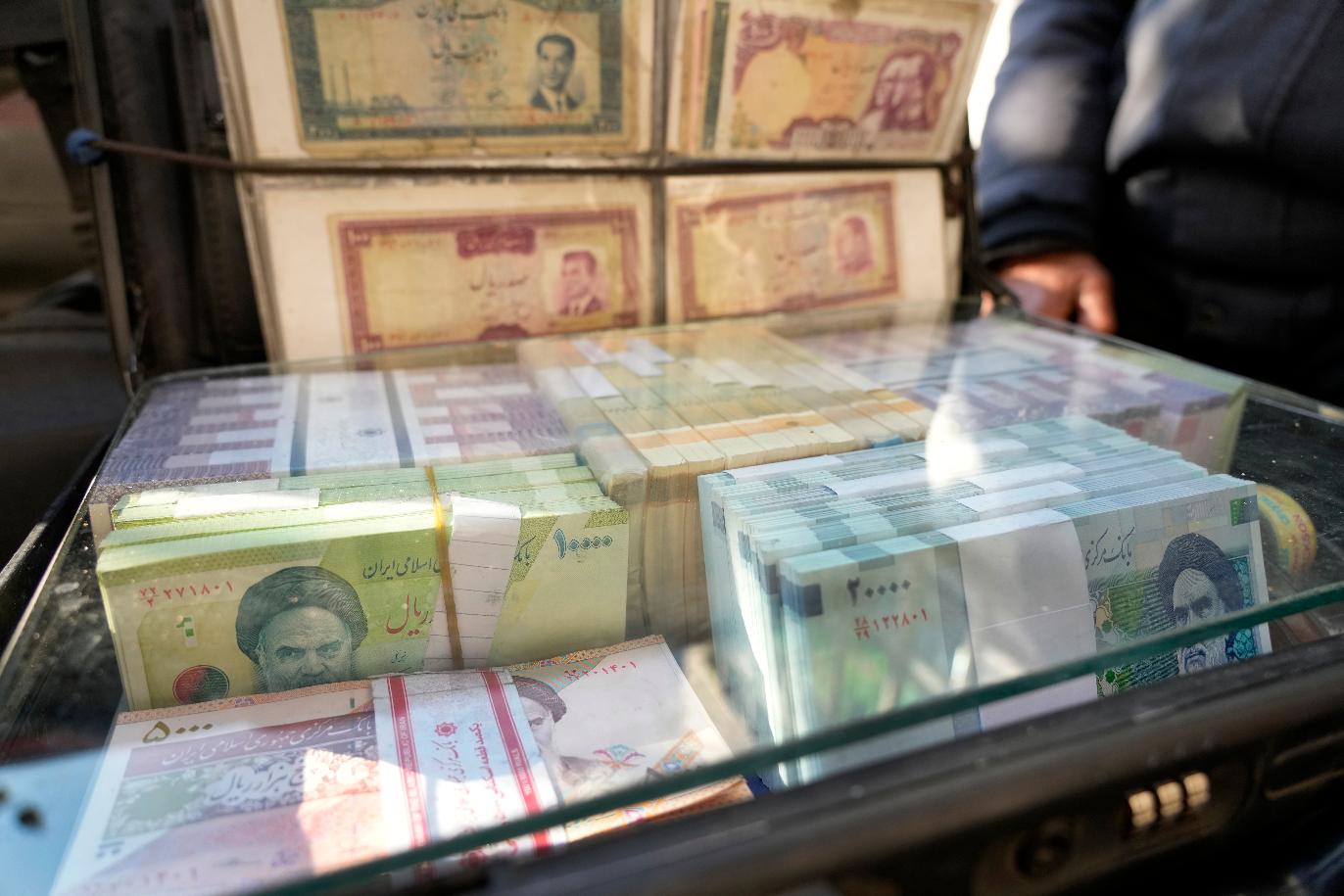 Iran's rial hits a record low, battered by regional tensions and an ...