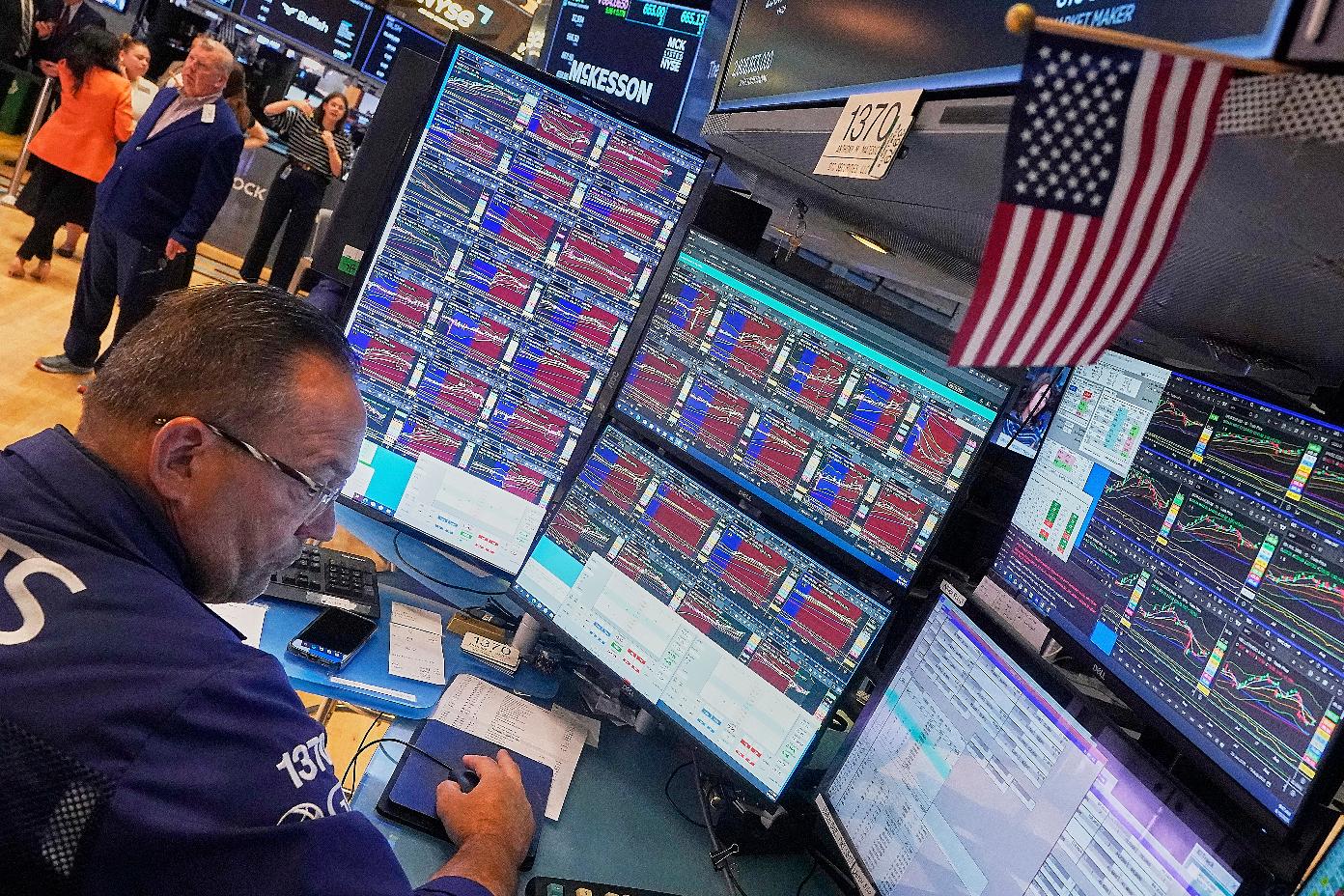 World shares mostly gain after uptick in inflation pulls US stocks lower
